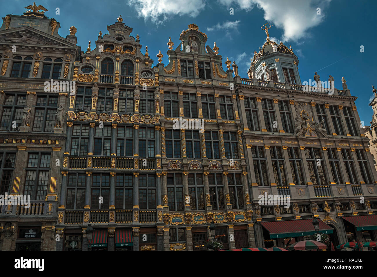 Facade of old typical buildings in the Grand Place of Brussels. Vibrant ...