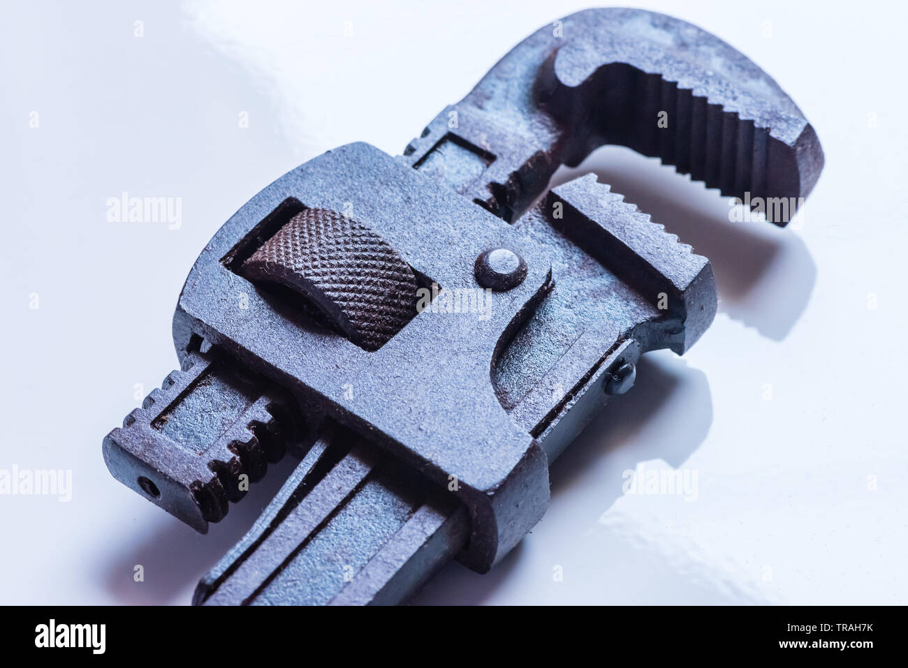 Macro view of stained pipe wrench hand tool in black greasy color Stock ...