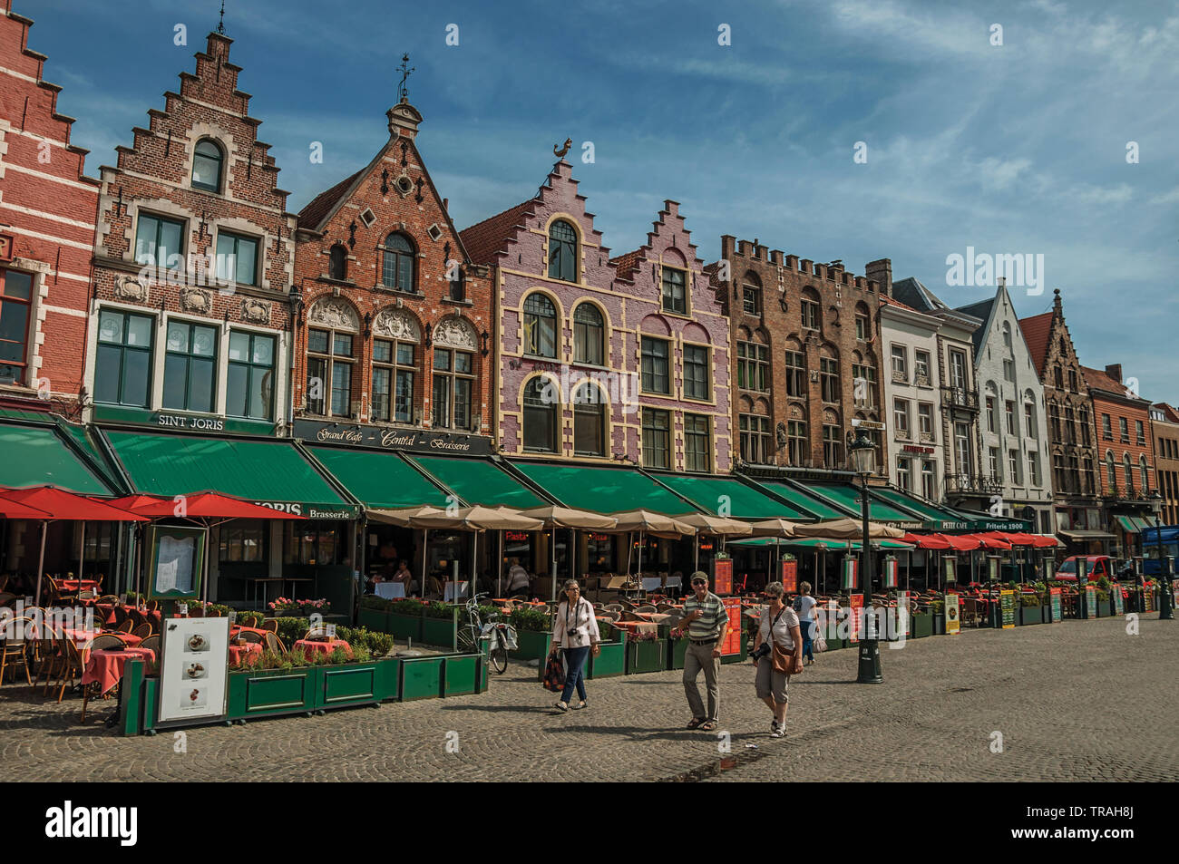 Building and people at the market Square in Bruges. Charming town with ...