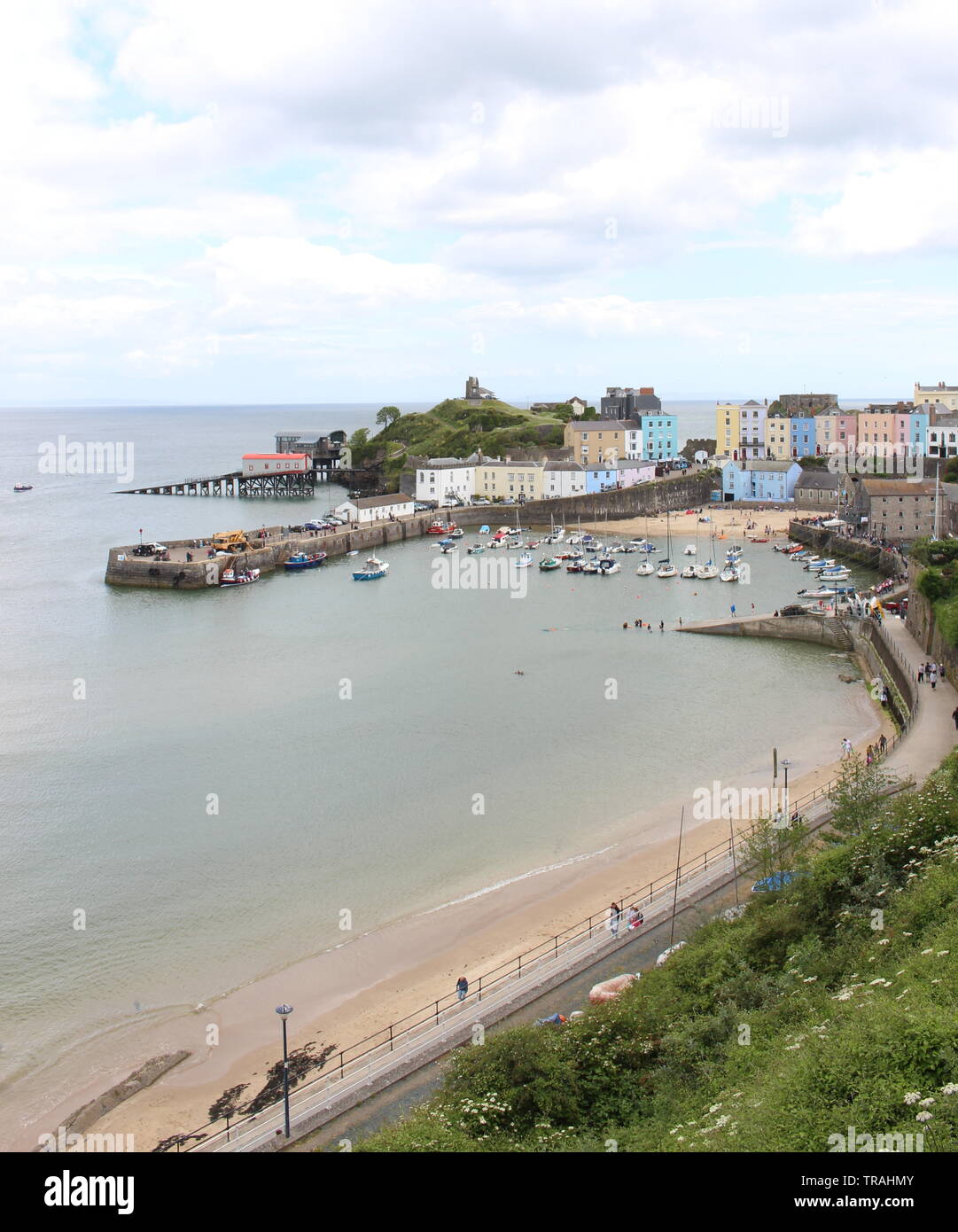 A photograph of Tenby harbour, Pembrokeshire, Wales, UK. Boats, houses ...