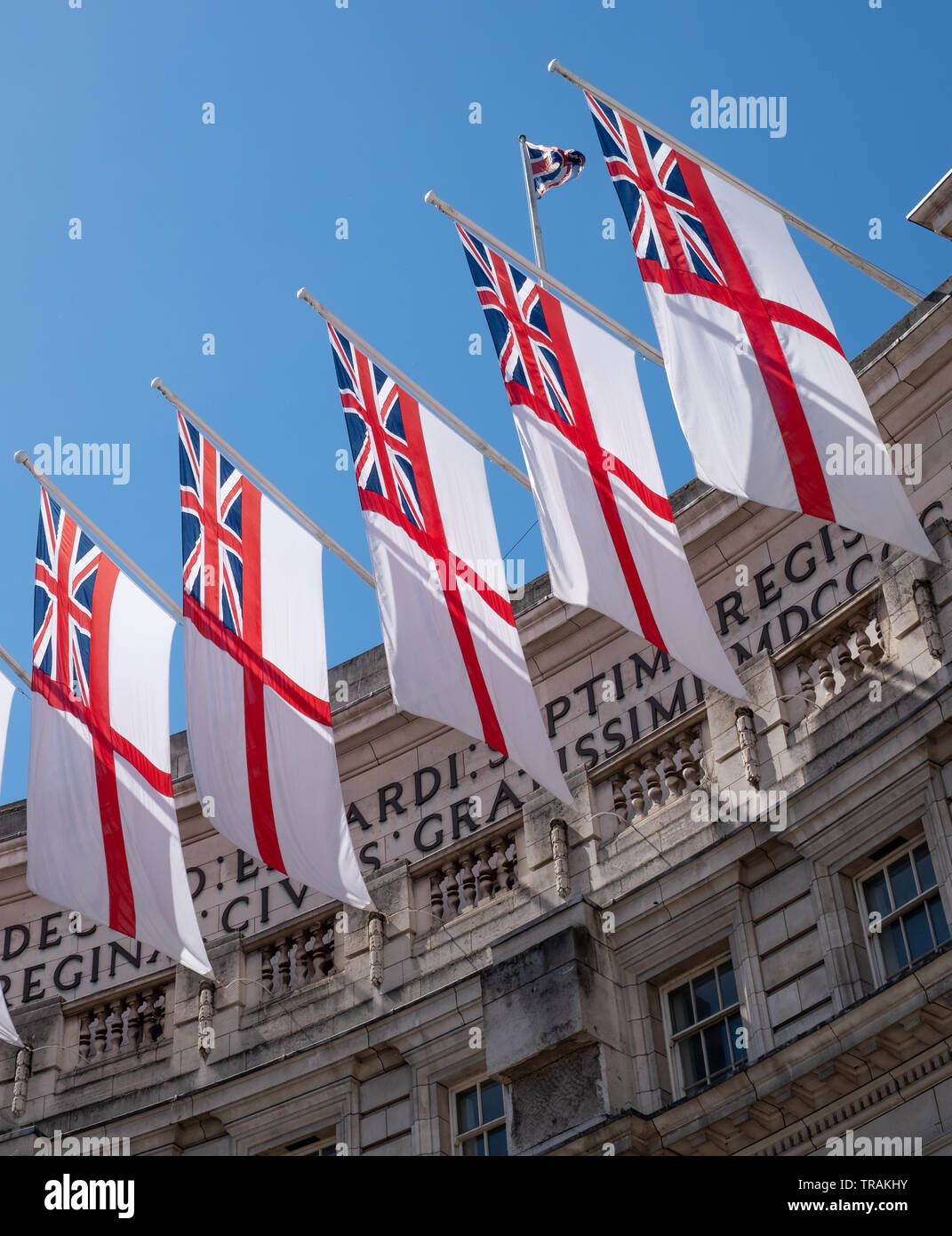 British naval white ensign flags flying at Admiralty Arch, building ...