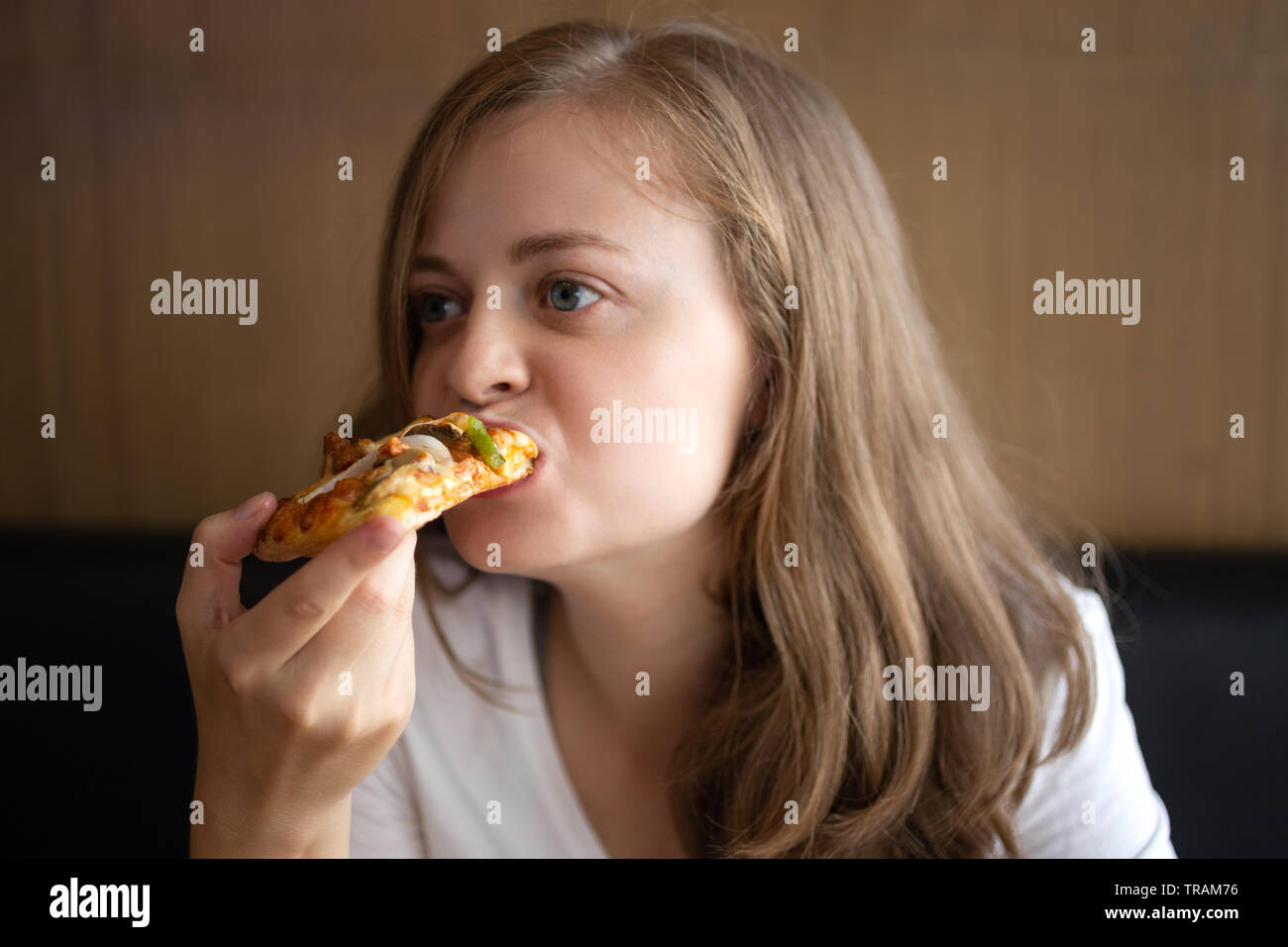 Beautiful woman eating pizza hi-res stock photography and images - Alamy