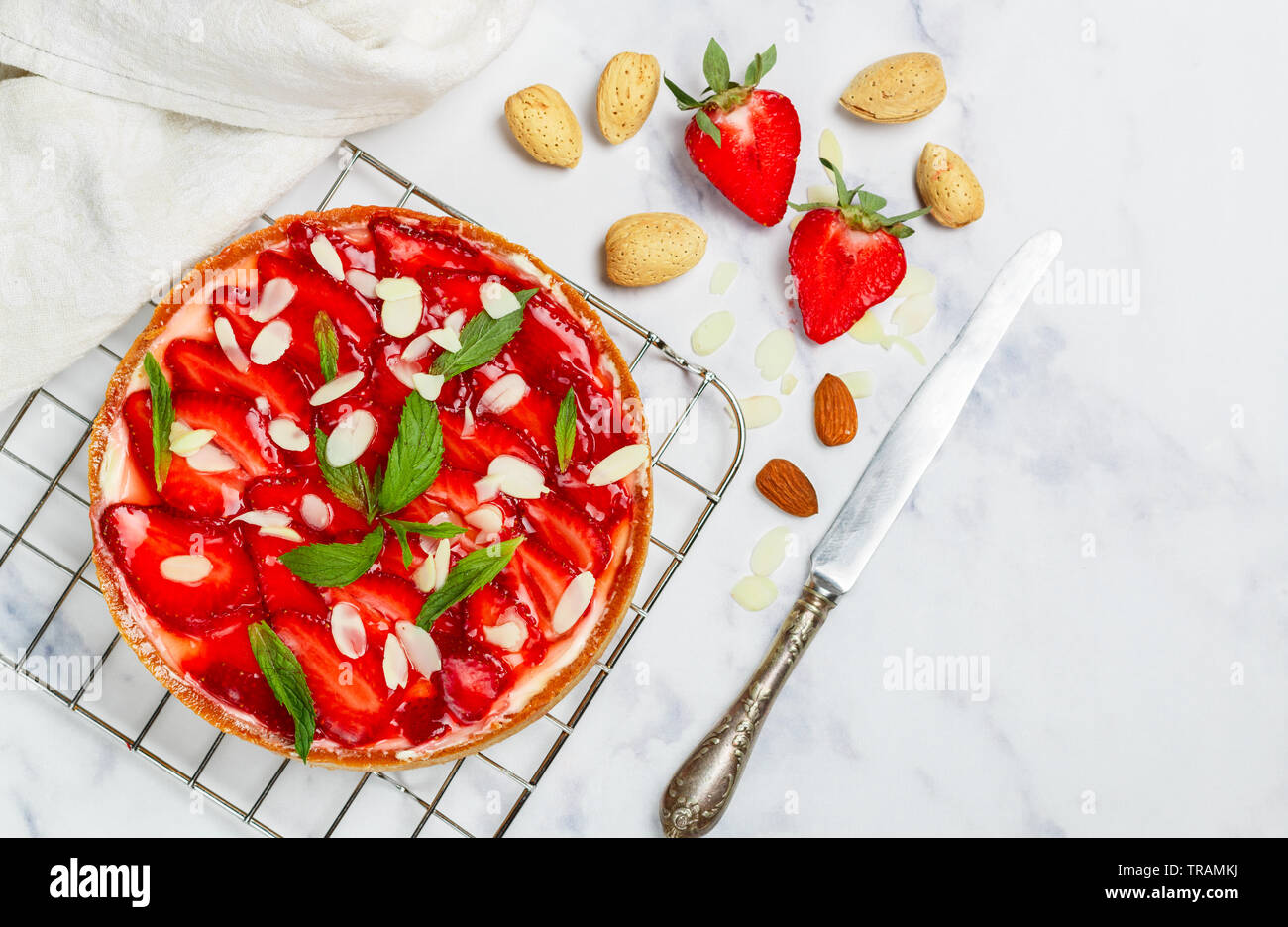 Homemade delicious strawberry tart with custard or whipped cream, mint ...