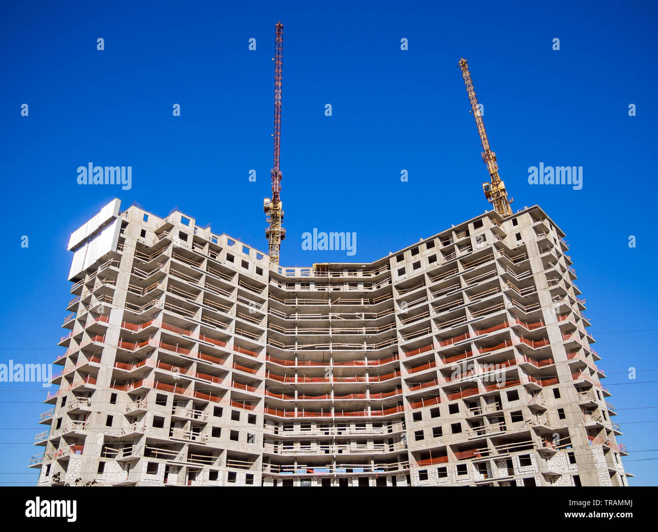 Monolithic new building on a background of clear sky Stock Photo - Alamy
