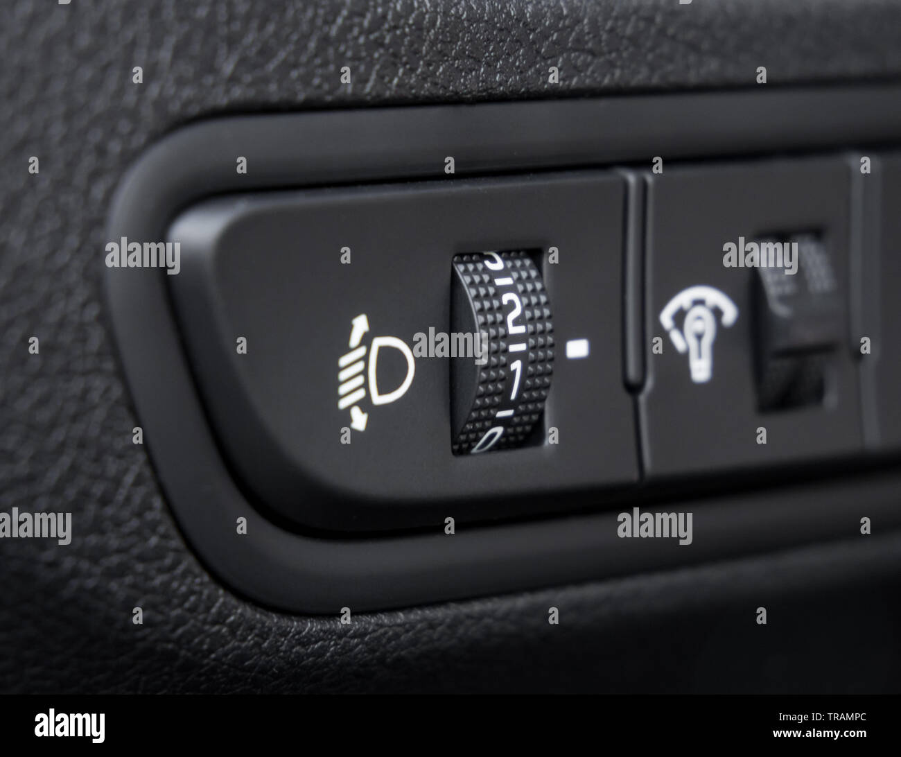 Headlight adjustment wheel on the control panel Stock Photo - Alamy