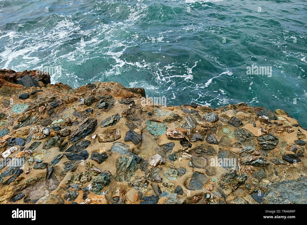 At the edge of a cliff facing the ocean Stock Photo - Alamy