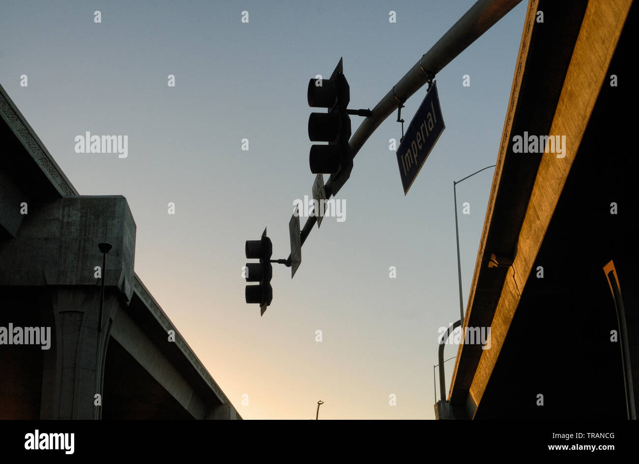 Silhouette of a traffic signal between two concrete raised ramps Stock ...