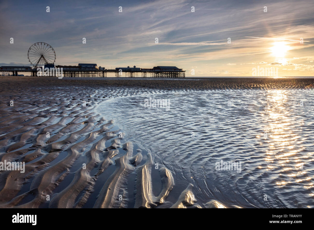 Blackpool Beach and South Pier at sunset Stock Photo - Alamy