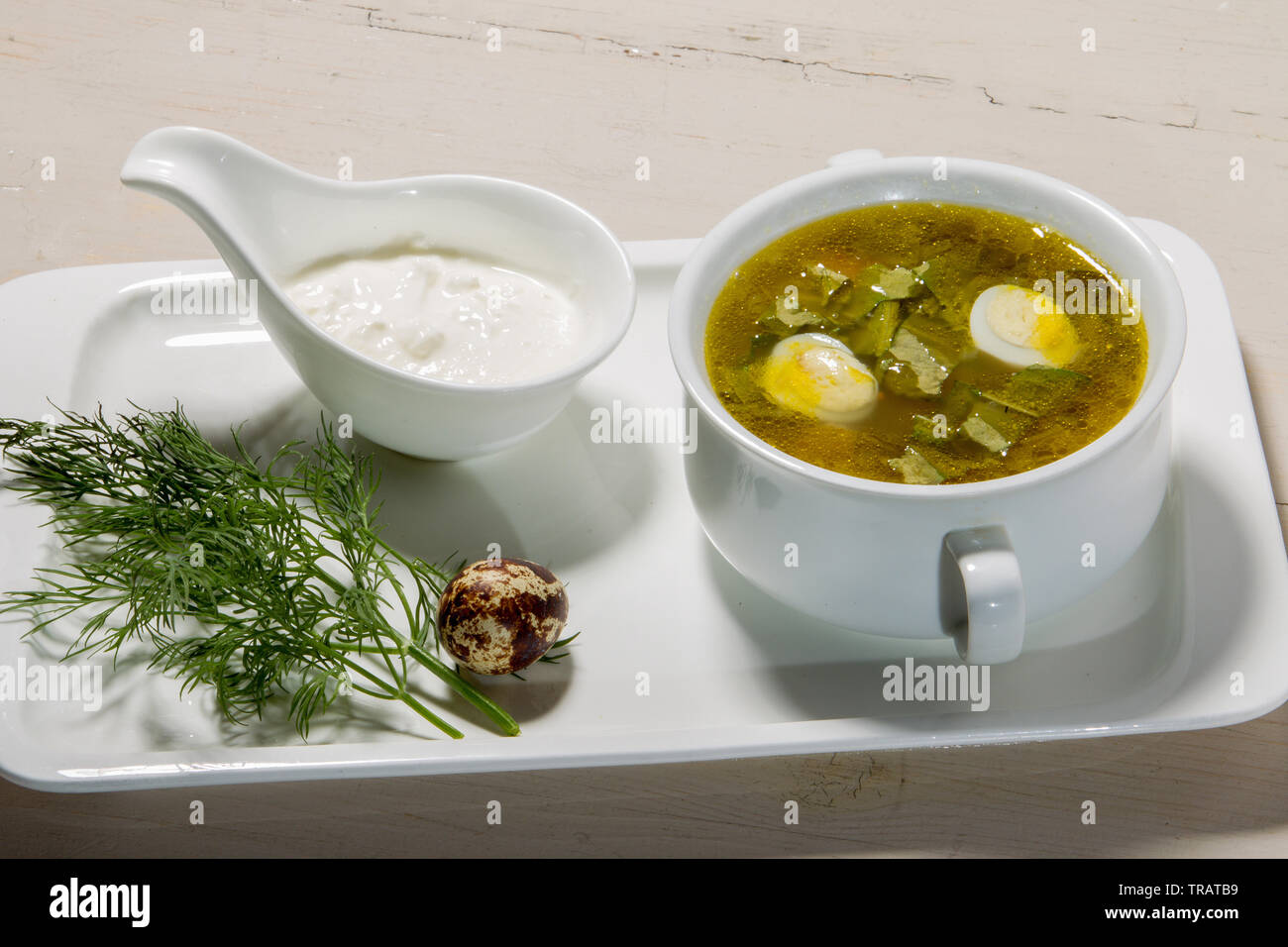 soup with sorrel and quail egg and cream Stock Photo - Alamy