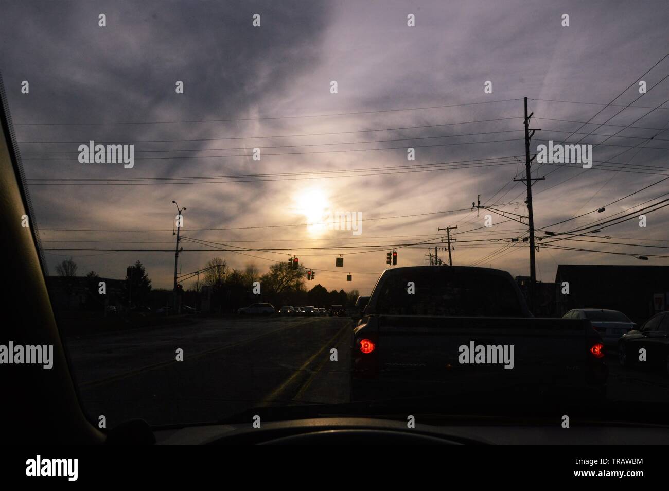 Sunset in traffic Stock Photo - Alamy