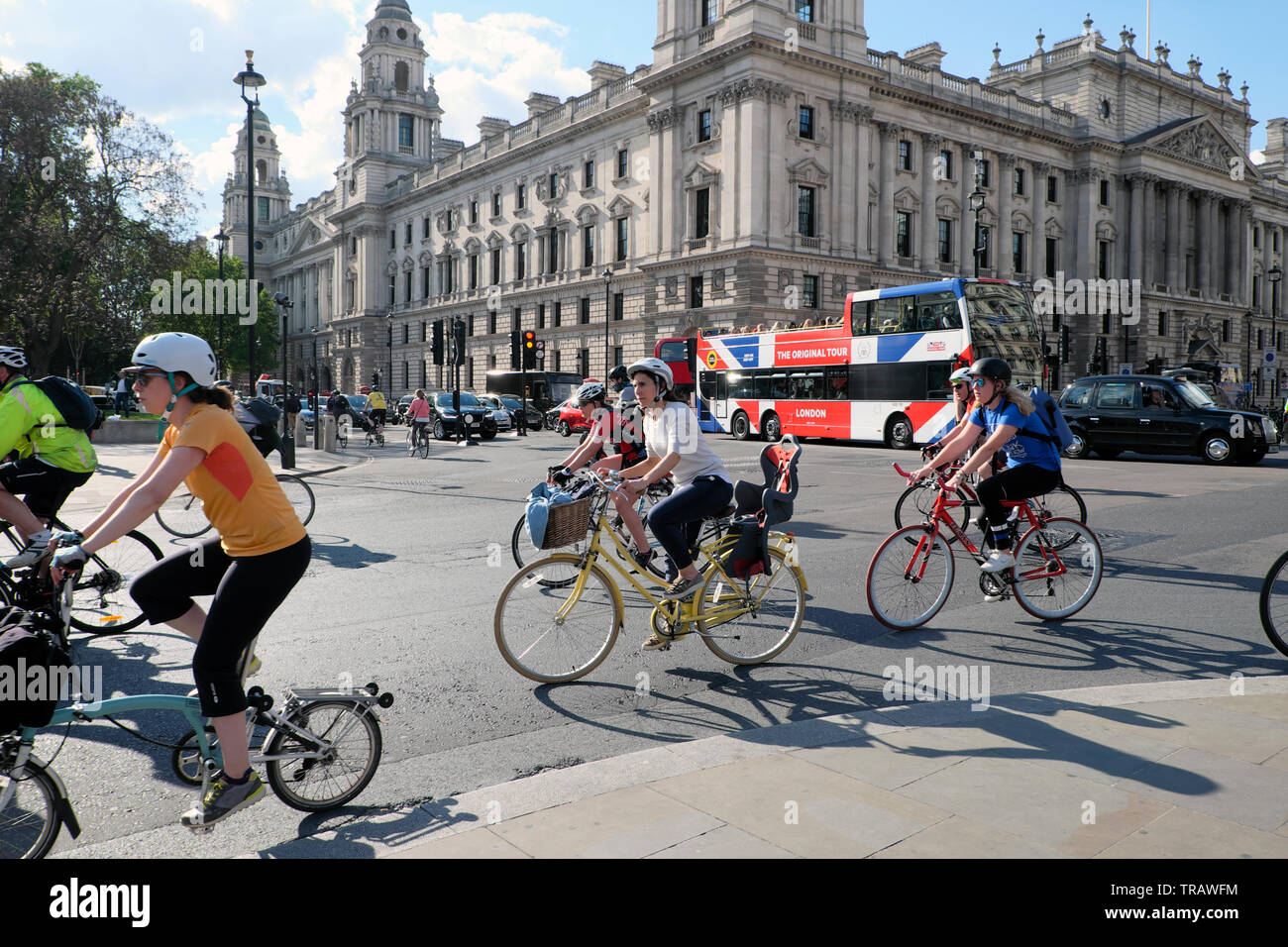 Cyclists turning corner from Bridge St cycle home after work riding ...
