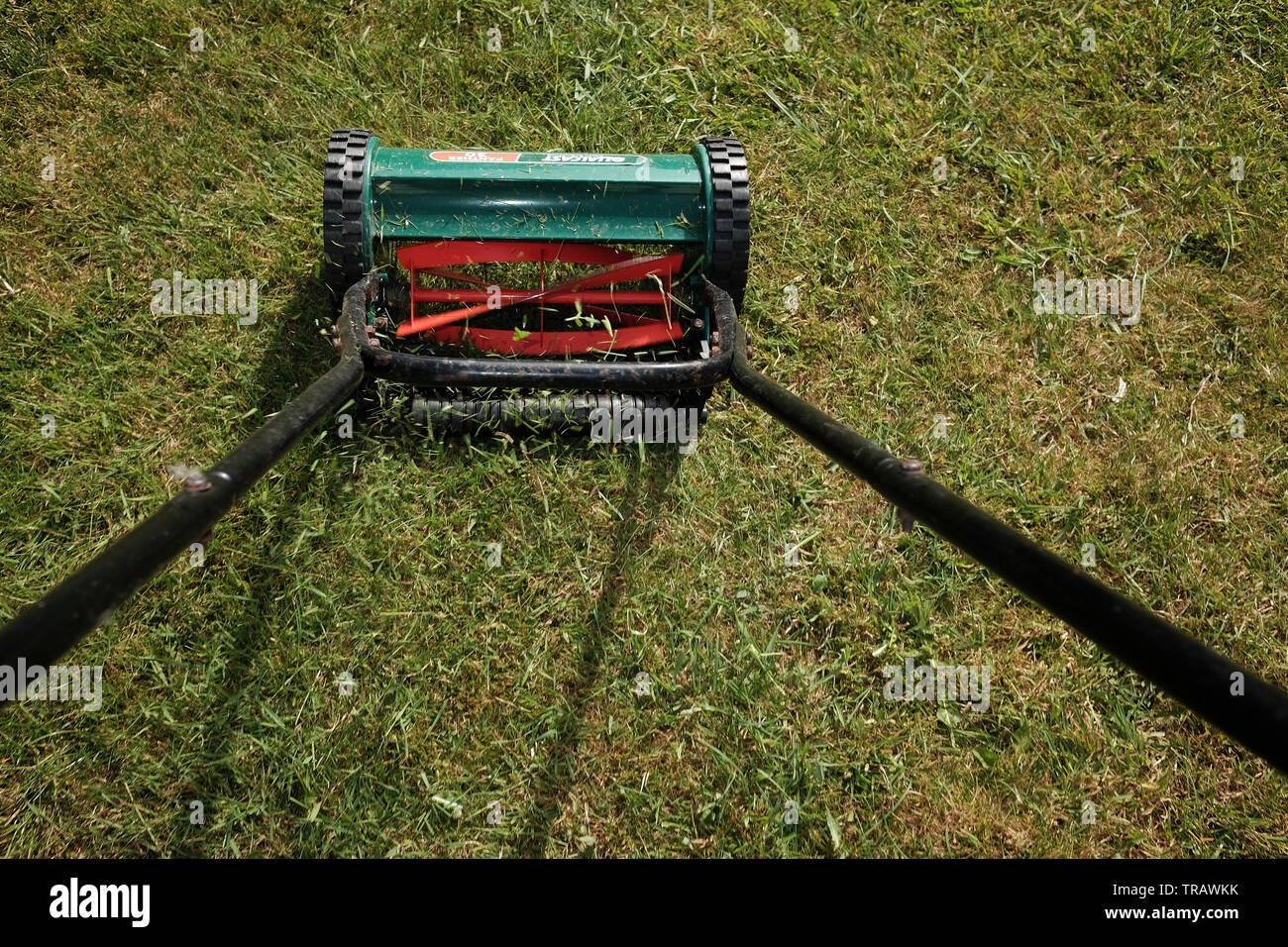 June 2019 - Traditional lawn mowing with a hand mower Stock Photo - Alamy