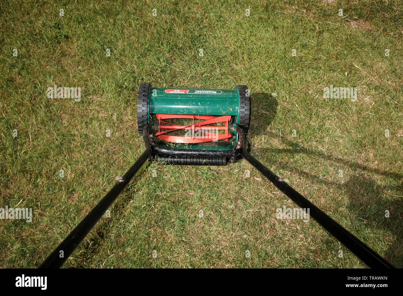 June 2019 - Traditional lawn mowing with a hand mower Stock Photo - Alamy