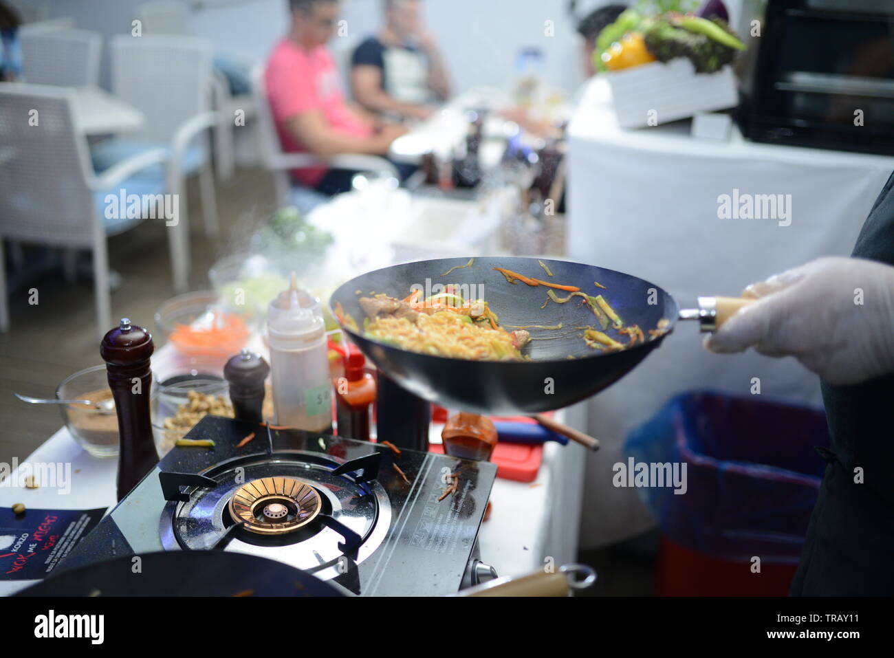 Chef cooks food in restaurant Stock Photo - Alamy