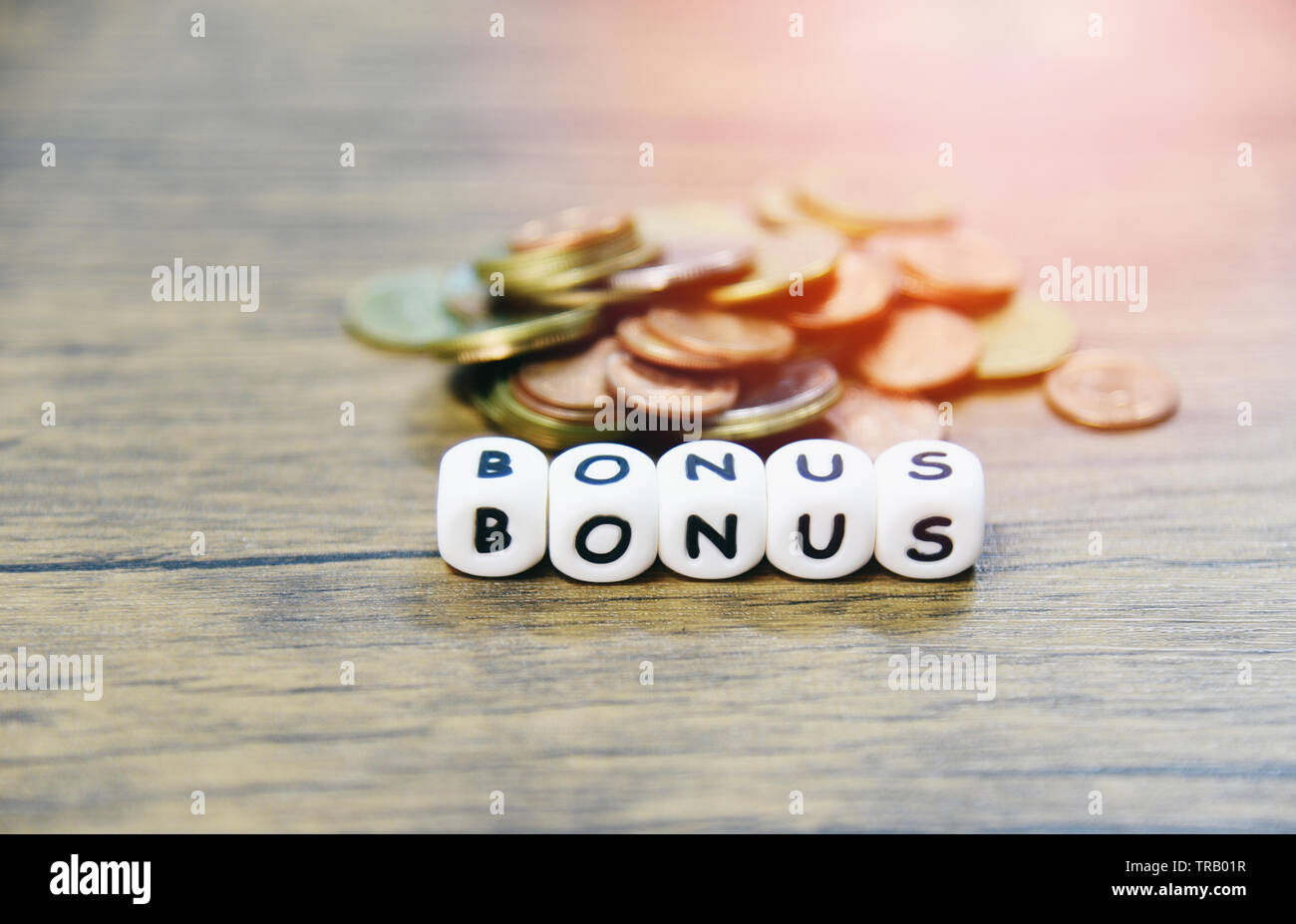 Yearly Bonus concept / words of Bonus and Stack coins on background for ...