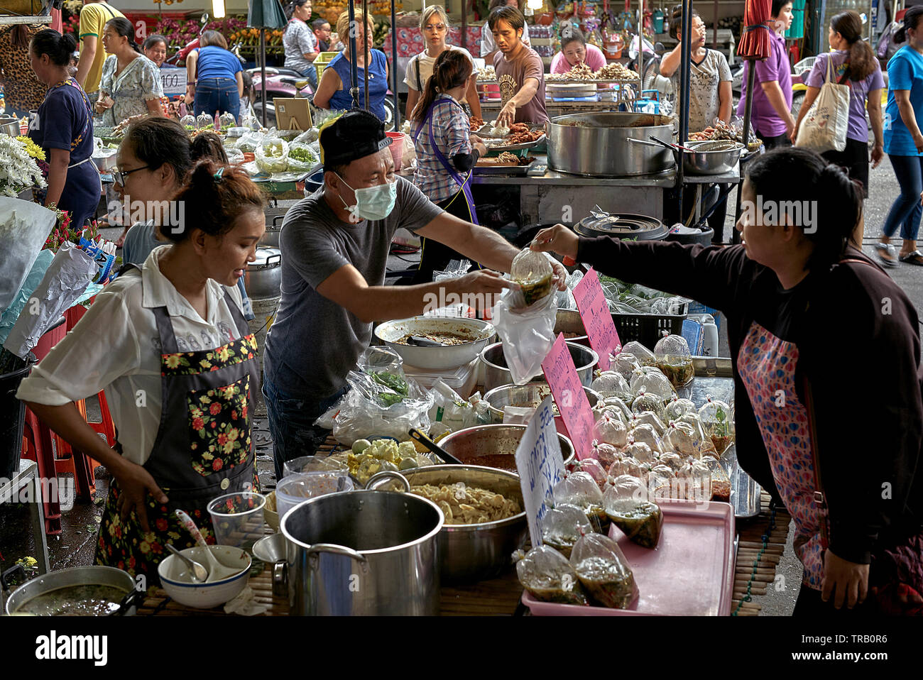 Thailand food market vendor serving customer Stock Photo - Alamy