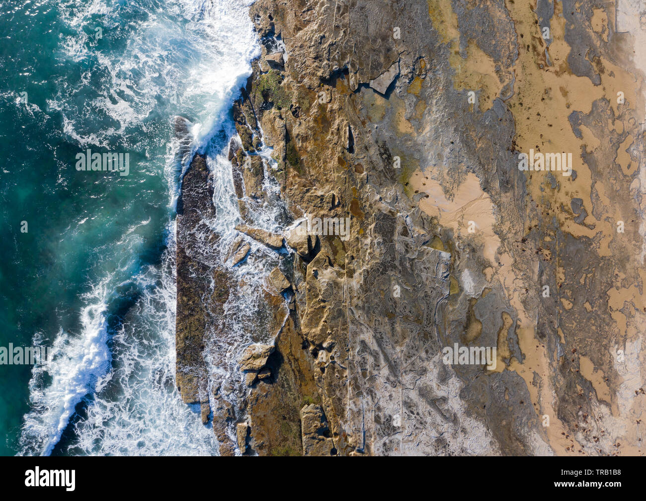 Top down view of rock platform and breaking wave at Dudley Beach ...