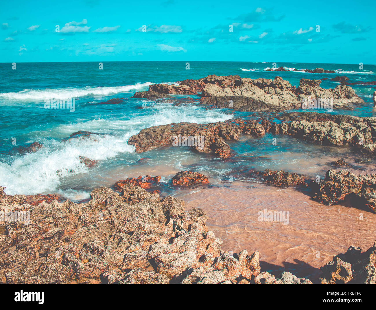 Waves tropical sea hit rocks hi-res stock photography and images - Alamy