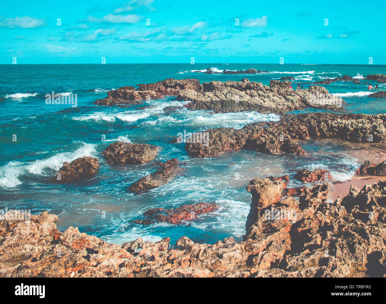 Sea waves hitting rocks on the beach. Big waves in the sea - blue water ...