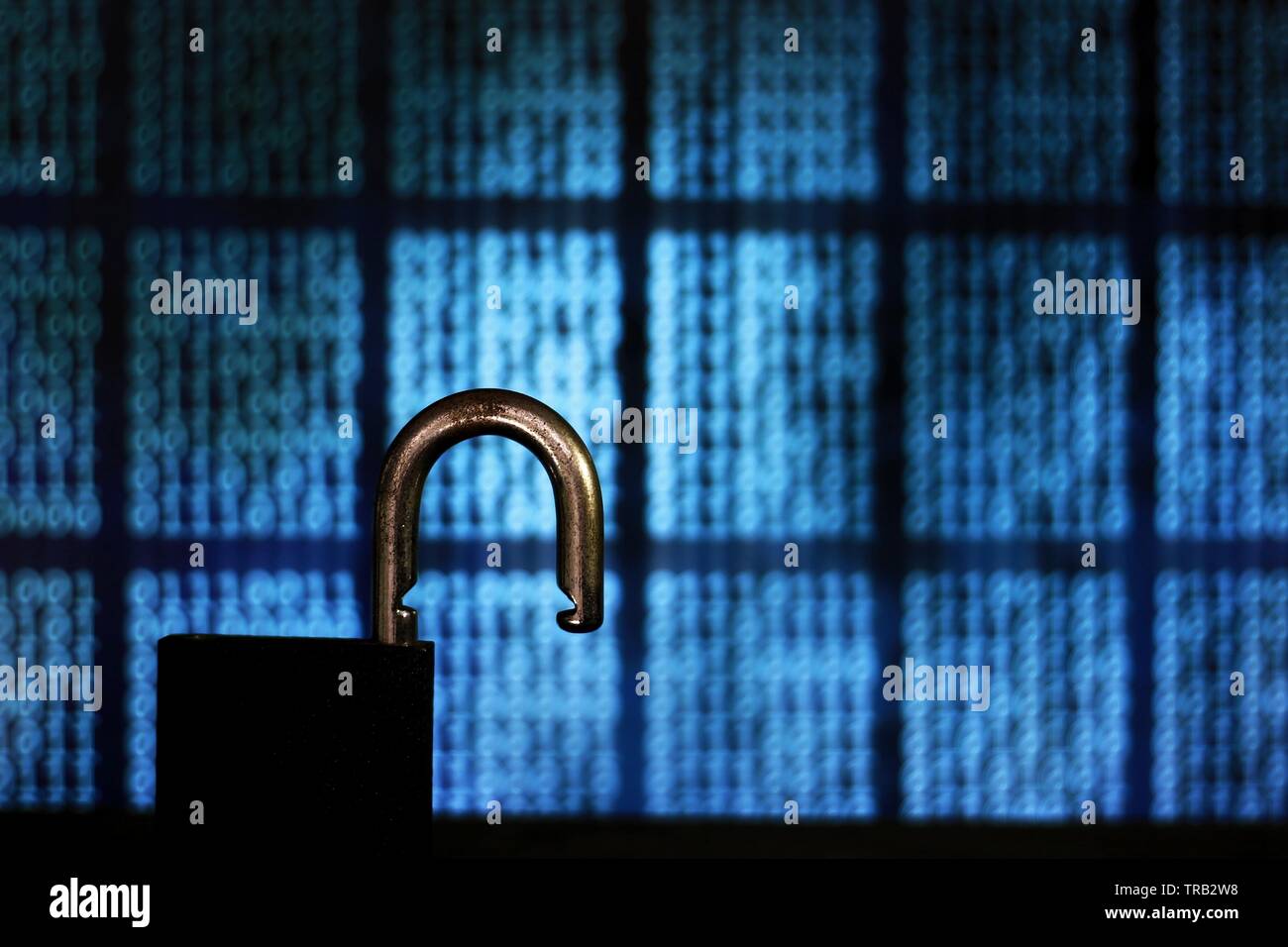 opened padlock in front of binary code blocks background. cyberspace ...