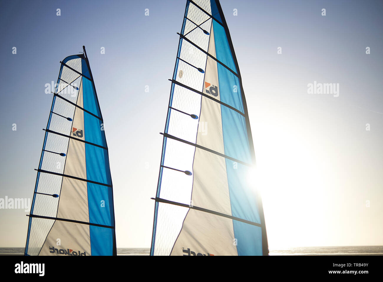 Beautiful abstract shot of two sails on the beach in bright sunshine ...