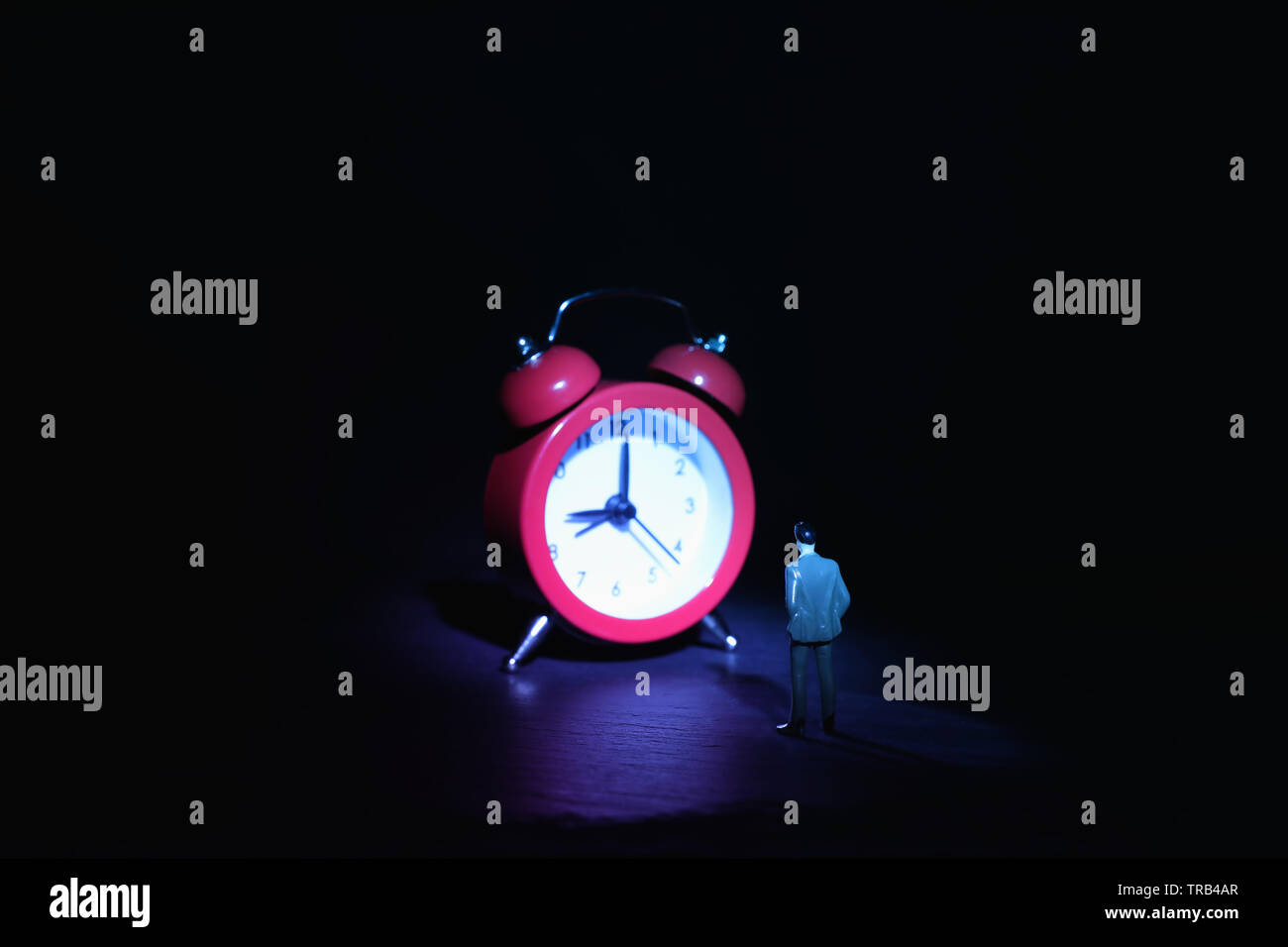 leadership concept, miniature man looking at clock, deadline and ...