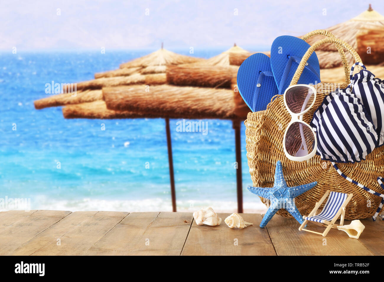 vacation and summer concept with sea life style objects over wooden ...
