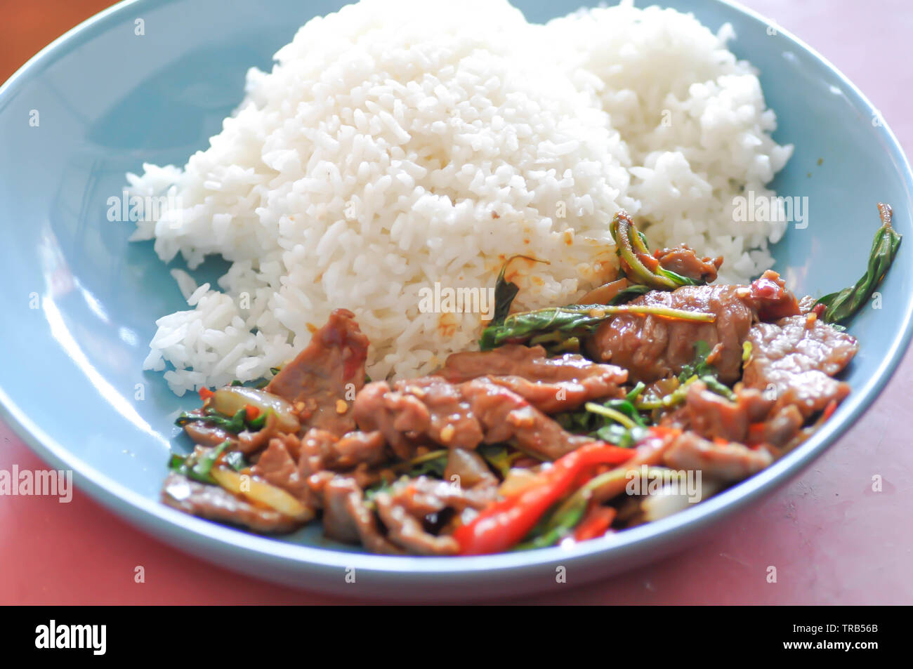 stir-fried beef or fried beef with sweet basil and rice Stock Photo - Alamy