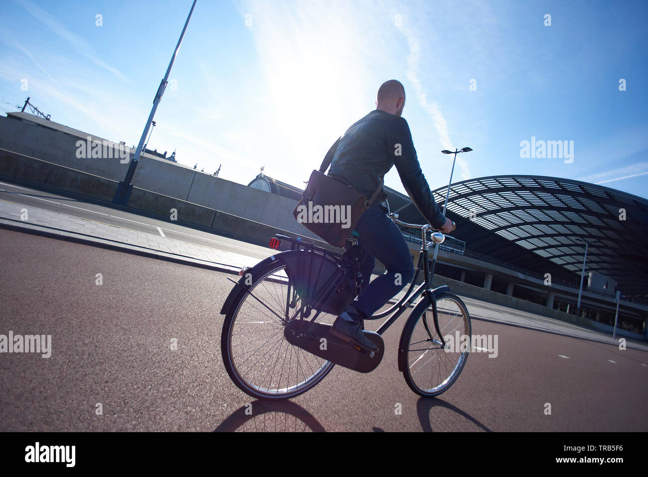 Amazing dynamic shot of people riding their bikes in the city centre of ...