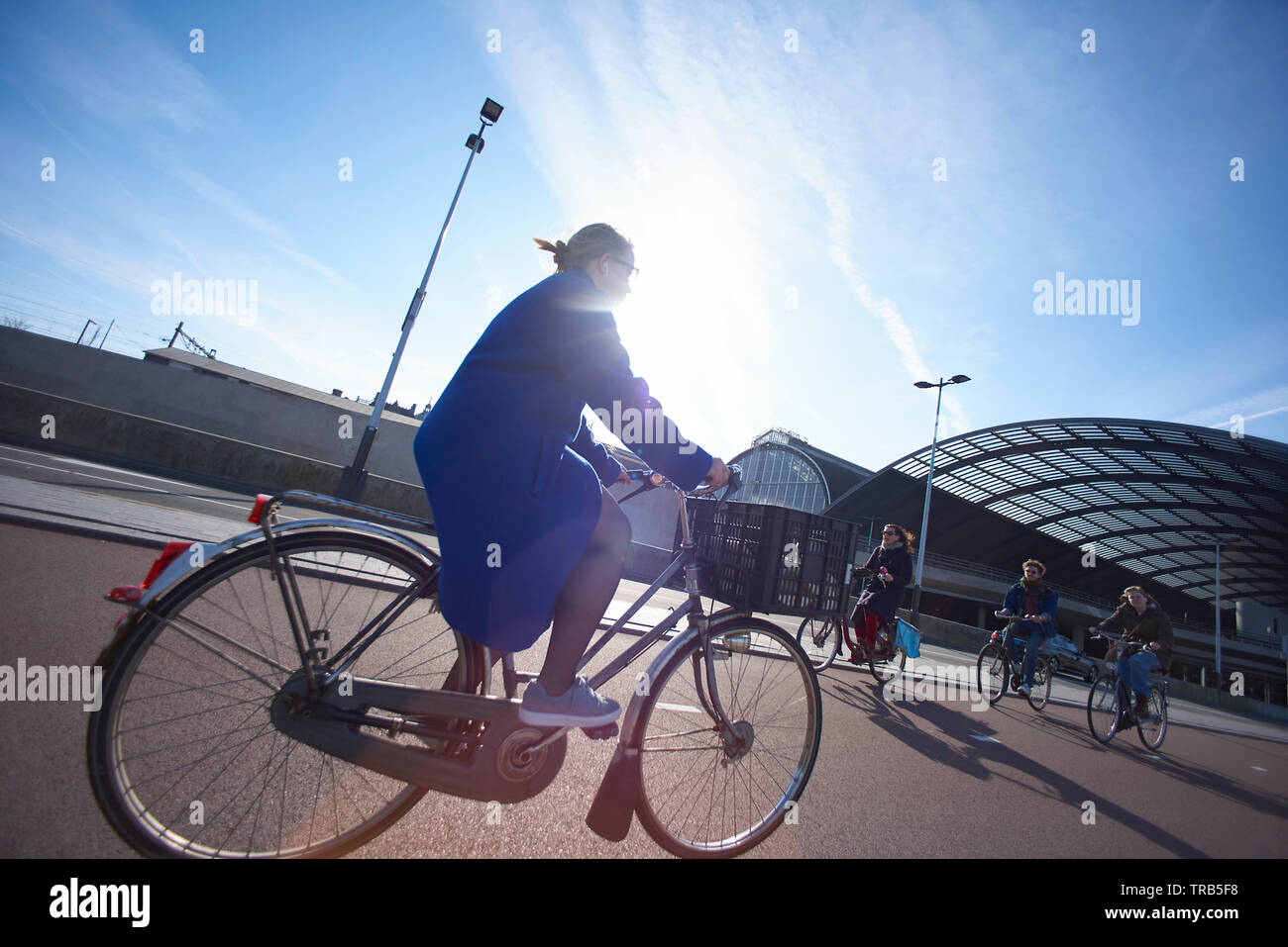 Amazing dynamic shot of people riding their bikes in the city centre of ...