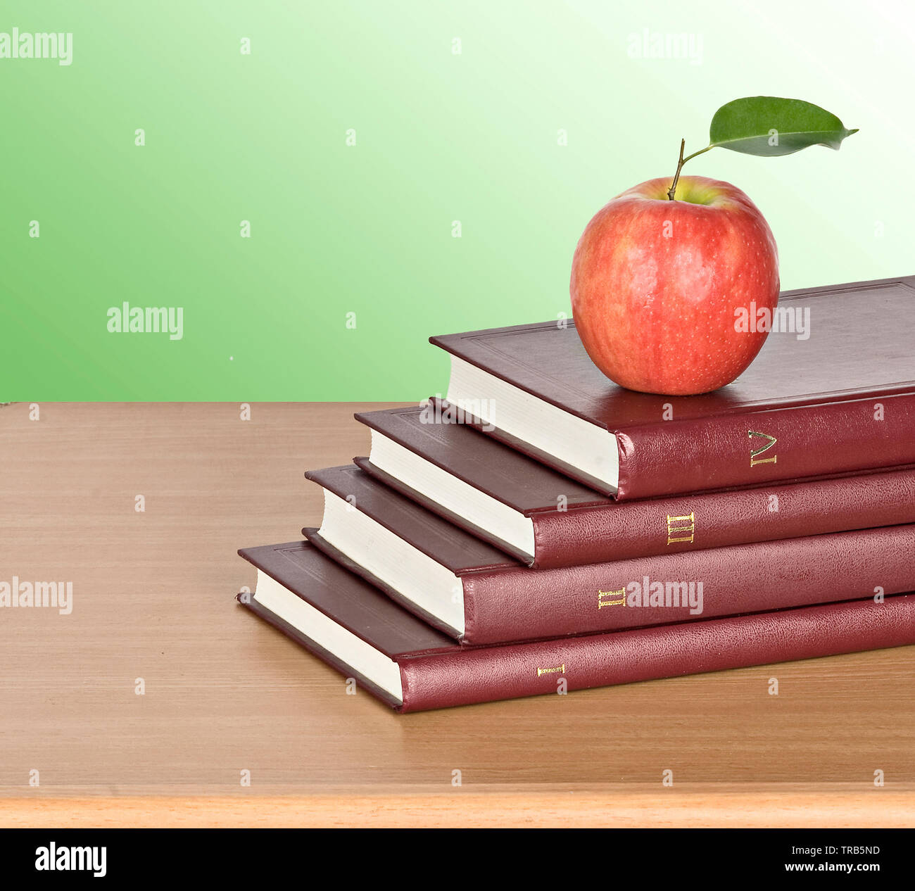 Books and apple Stock Photo - Alamy