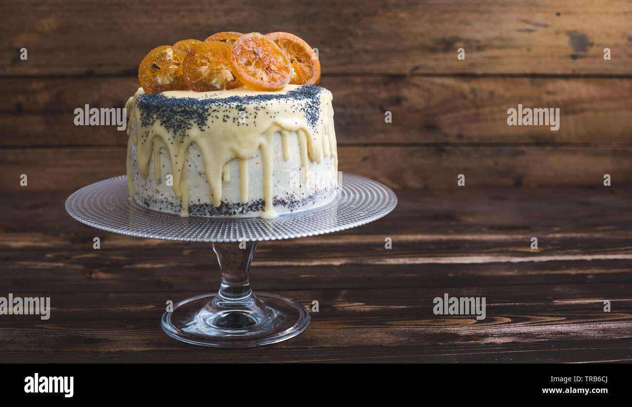 Poppy Seed Cake with White Chocolate and Caramelized Orange on Rustic ...