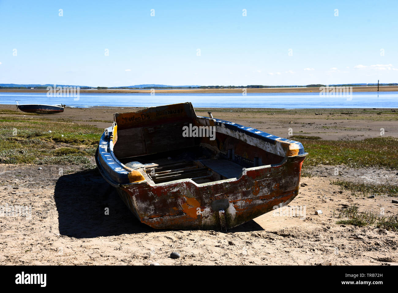 Old boat left stranded Stock Photo - Alamy