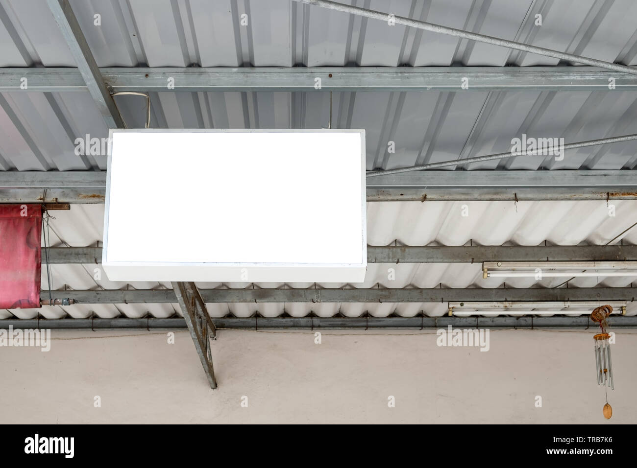 Billboard banner shop signs holding on roof stainless Stock Photo - Alamy