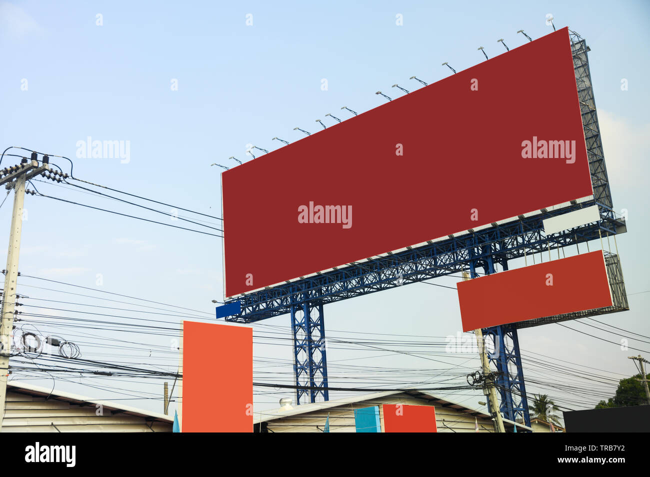 Blank large billboard with placard with wire electricity in center ...