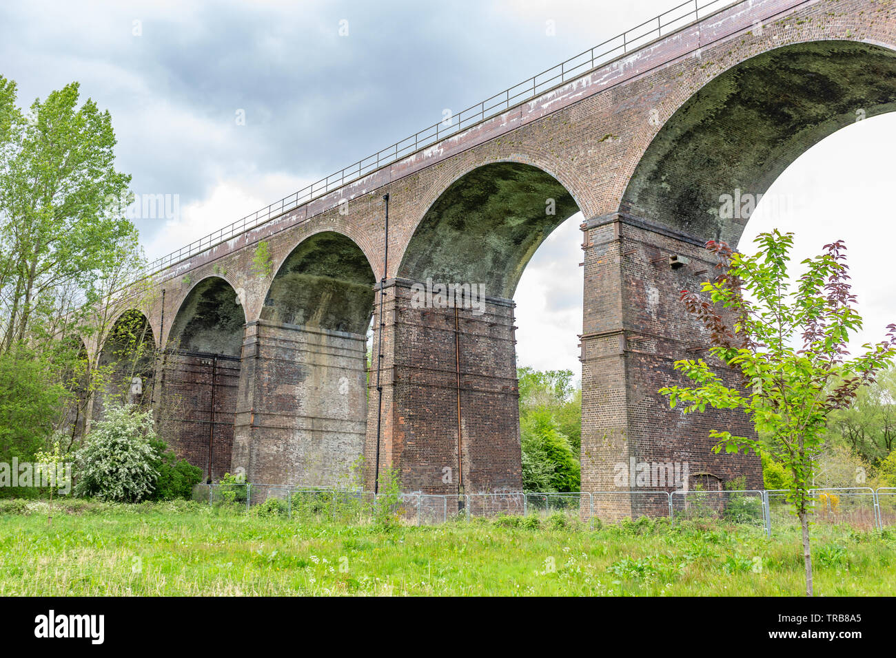 Railway viaduct at Reddish Vale, Stockport, Cheshire, UK. The 16-arch ...