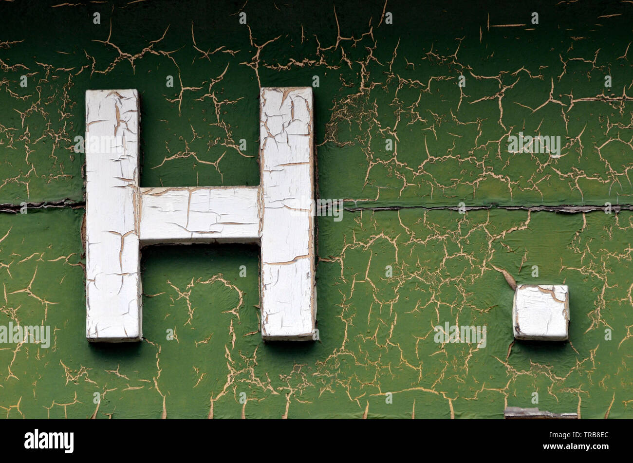 weathered patinated painted shop name letter H Stock Photo - Alamy