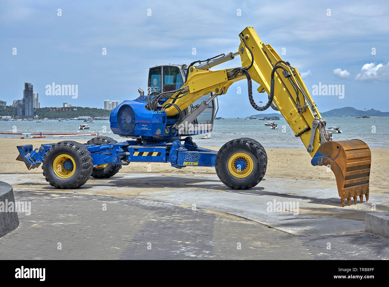 Backhoe sand excavator employed in the beach reclamation project at ...