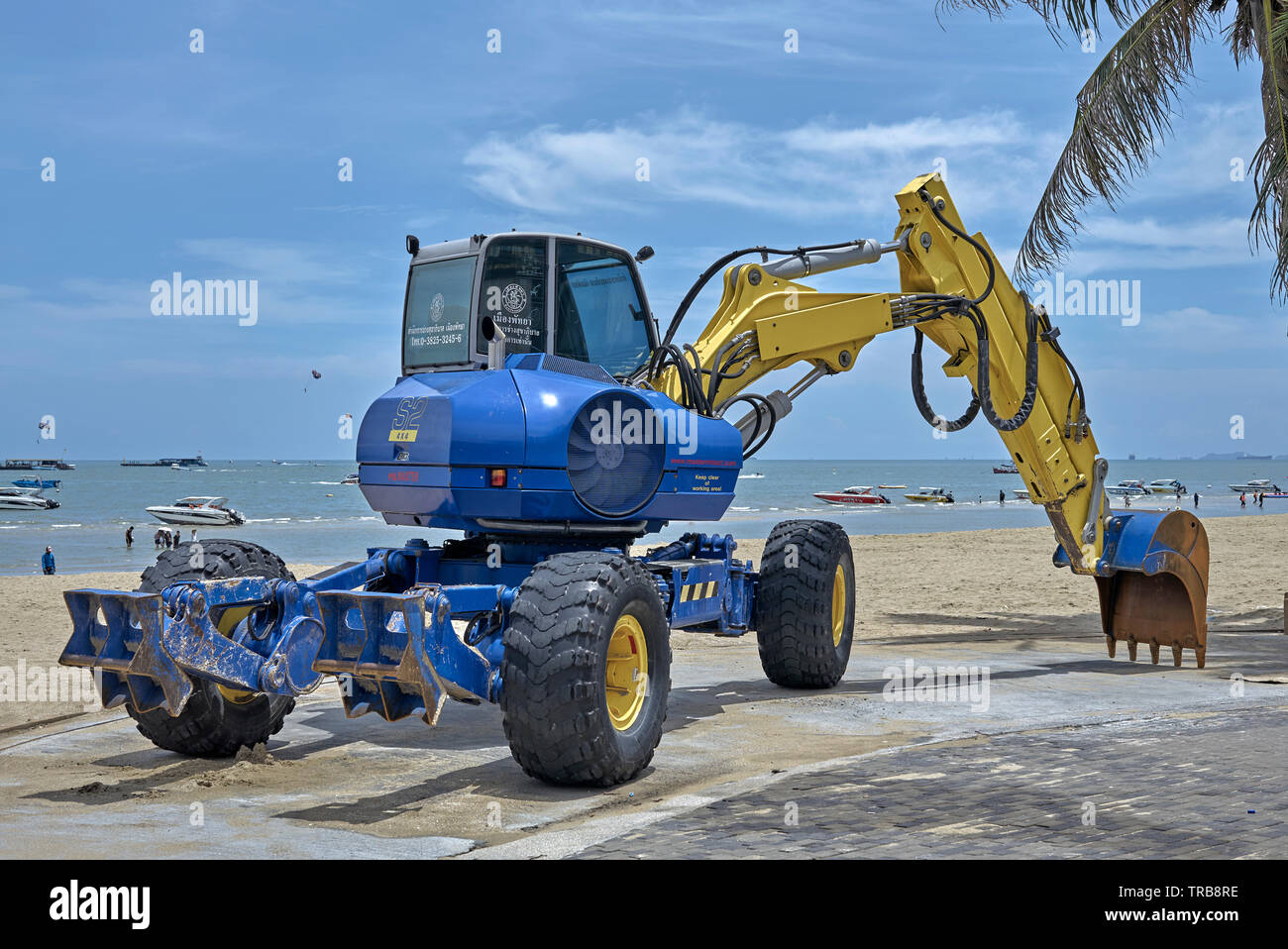 Backhoe sand excavator employed in the beach reclamation project at ...