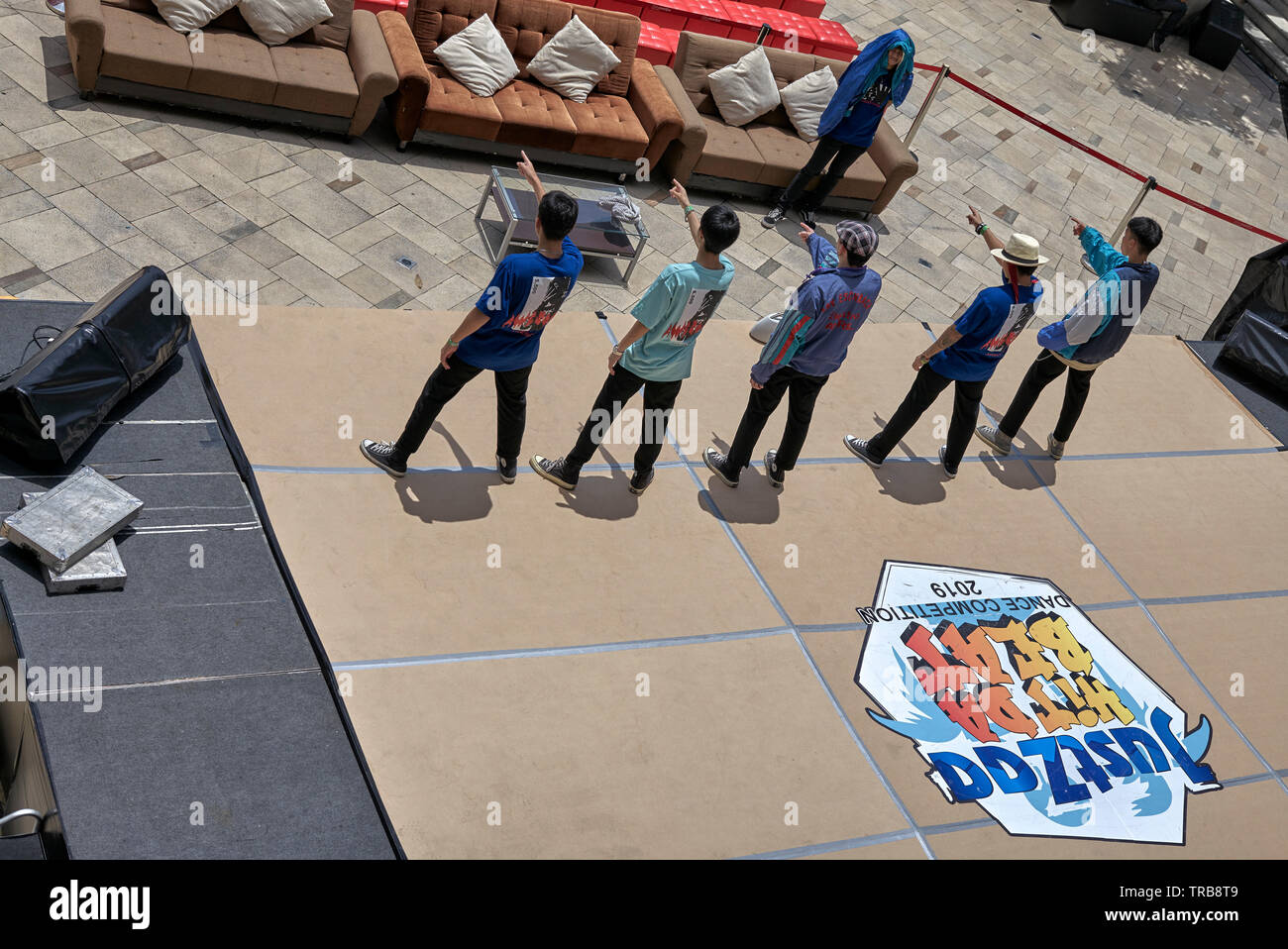 Overhead view of stage rehearsal of boy band dance group performing at ...
