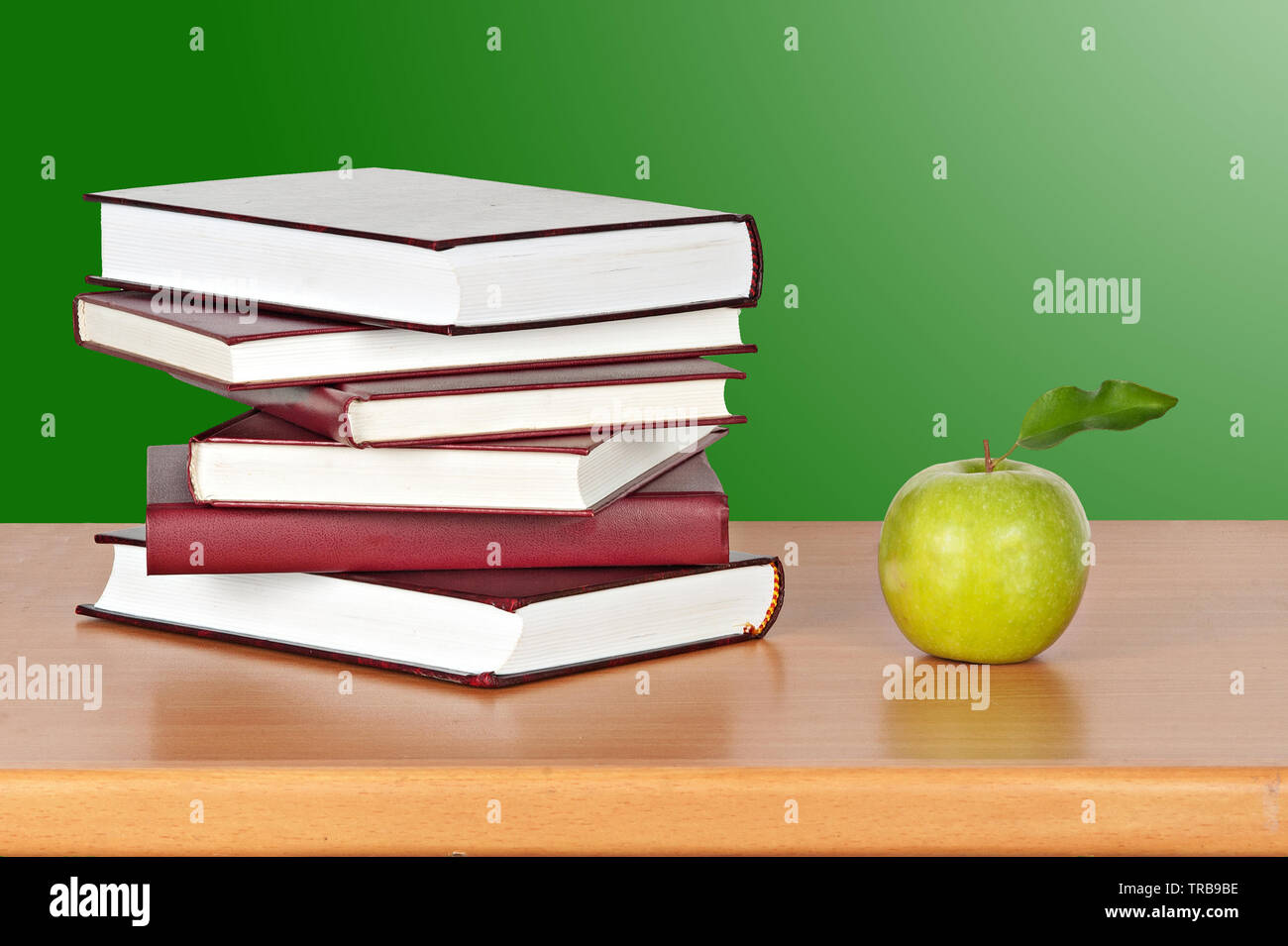 Books and apple Stock Photo - Alamy