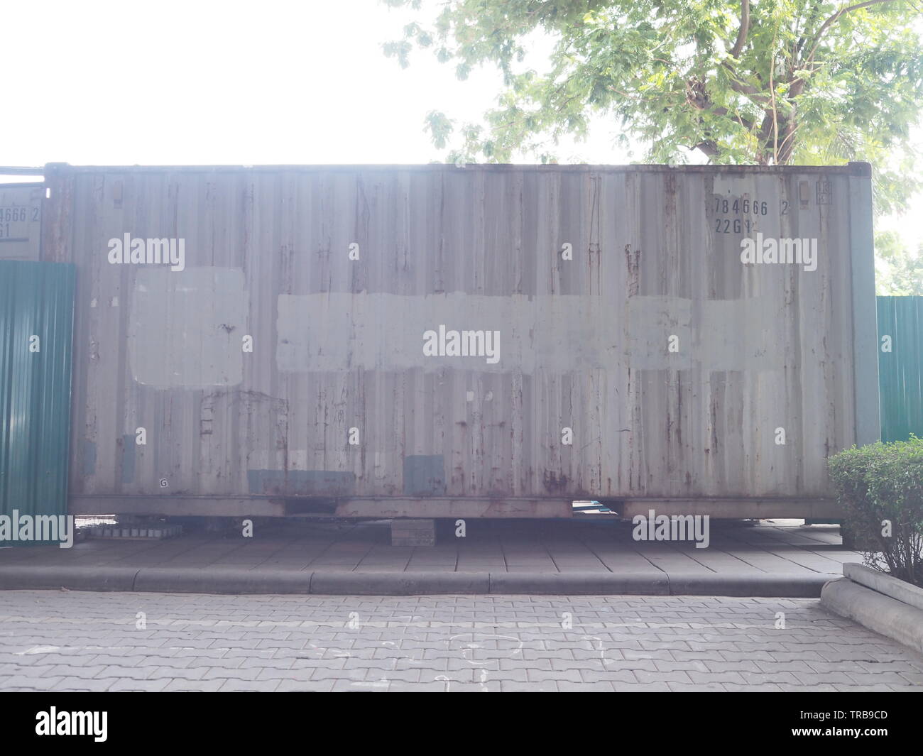 container gray color on the walkway Stock Photo - Alamy