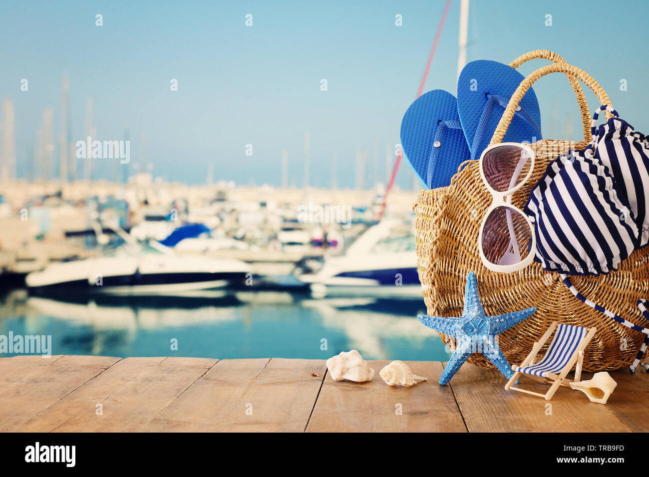 vacation and summer concept with sea life style objects over wooden ...