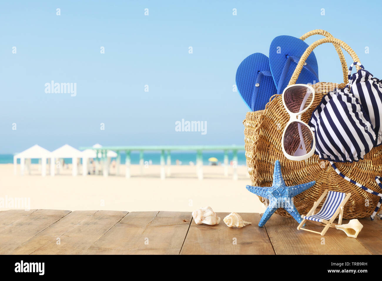 vacation and summer concept with sea life style objects over wooden ...