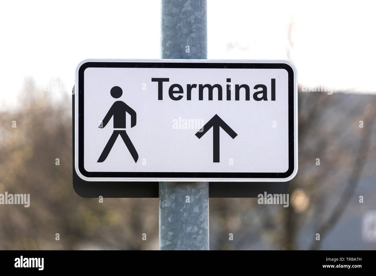 airport terminal walking sign Stock Photo - Alamy