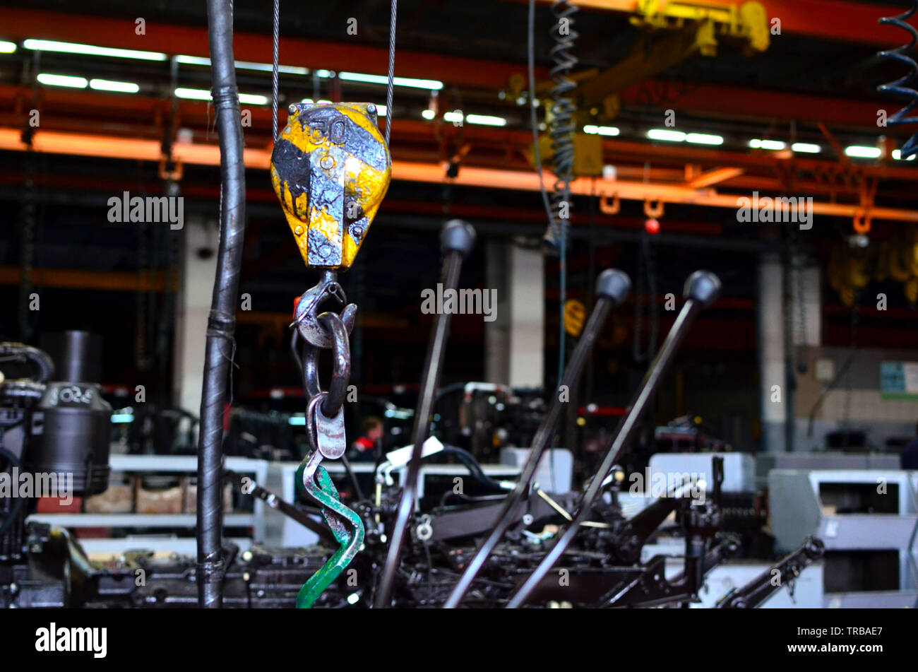 Bridge lifting Crane Hook against the background of the Assembly Line ...
