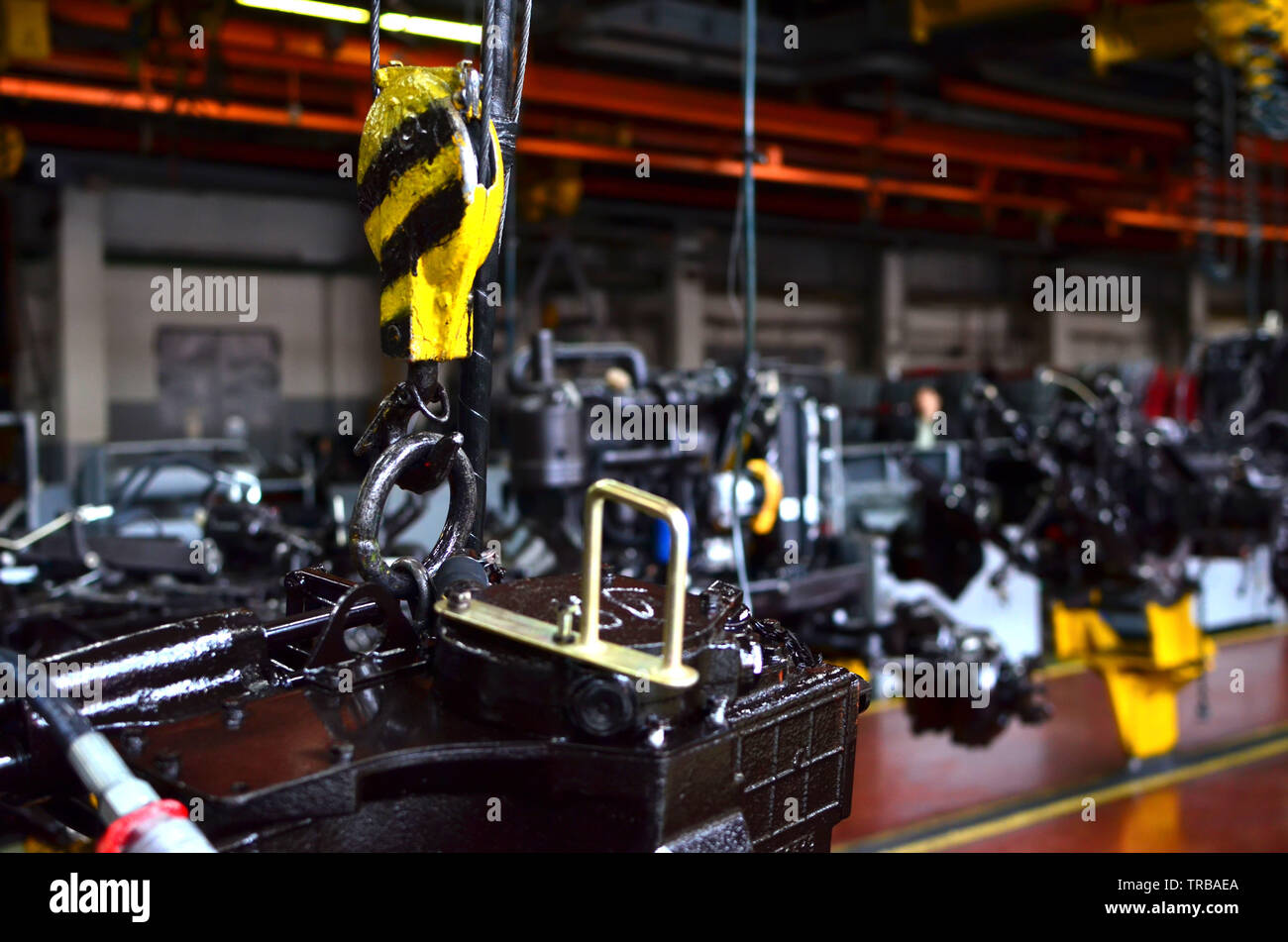 Bridge lifting Crane Hook against the background of the Assembly Line ...