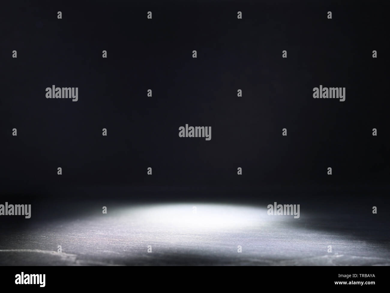 abstract dark concentrate floor scene with mist or fog, spotlight and ...
