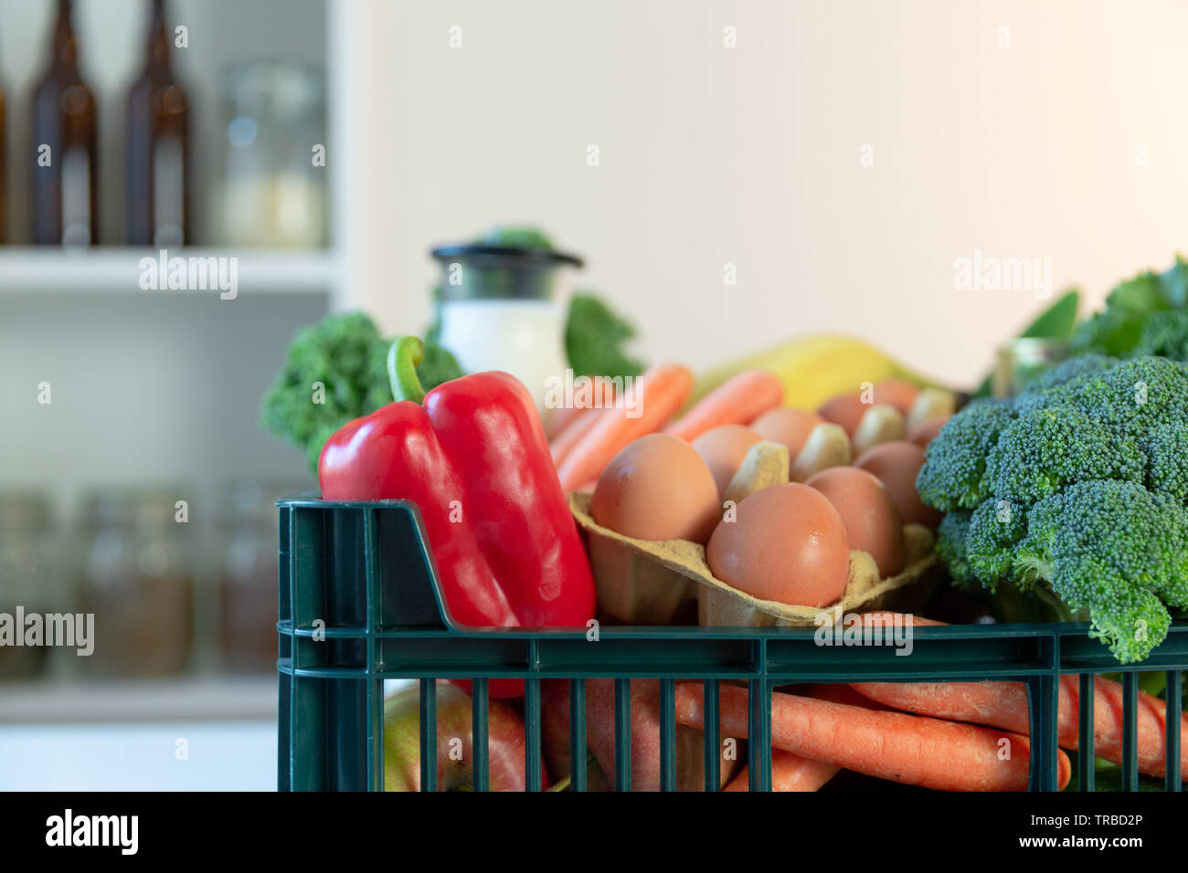 Fresh healthy groceries and vegetables from supermarket in green tray ...