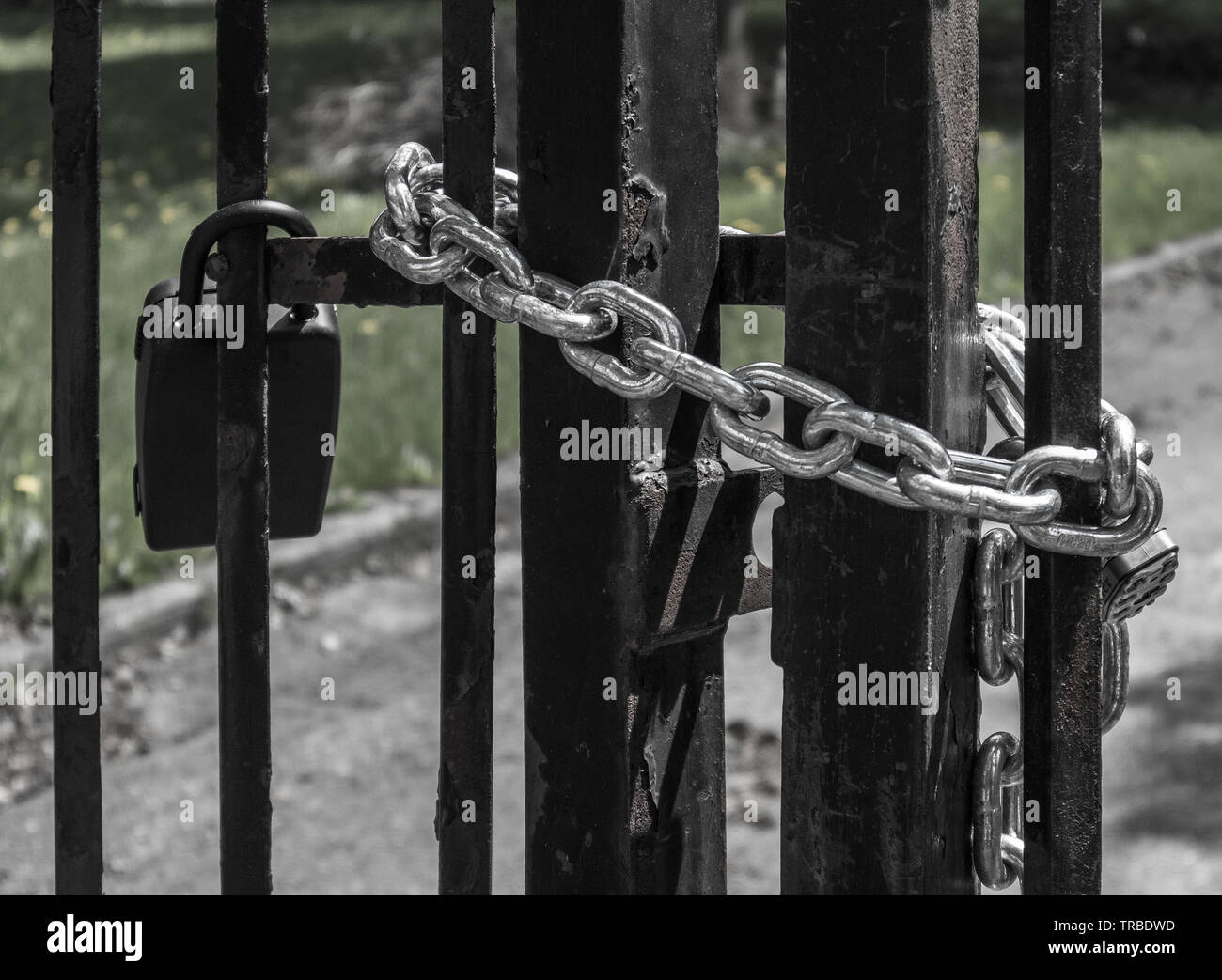 A padlocked iron gate with a chain Stock Photo - Alamy